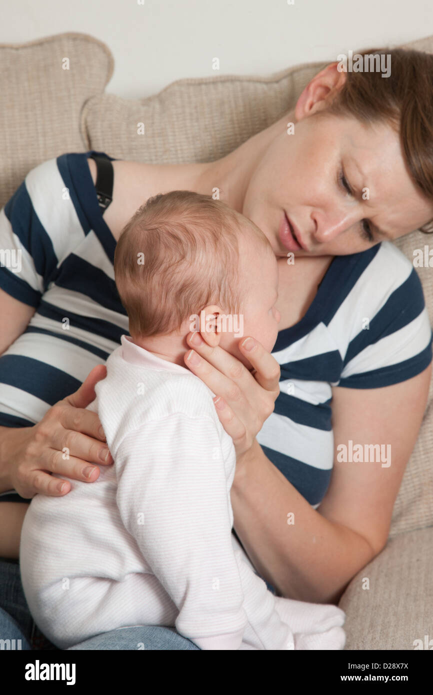 Mother winding baby after feed Stock Photo - Alamy