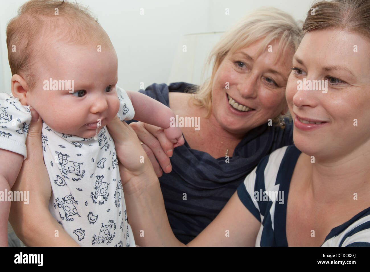 Three generations of a family Stock Photo - Alamy
