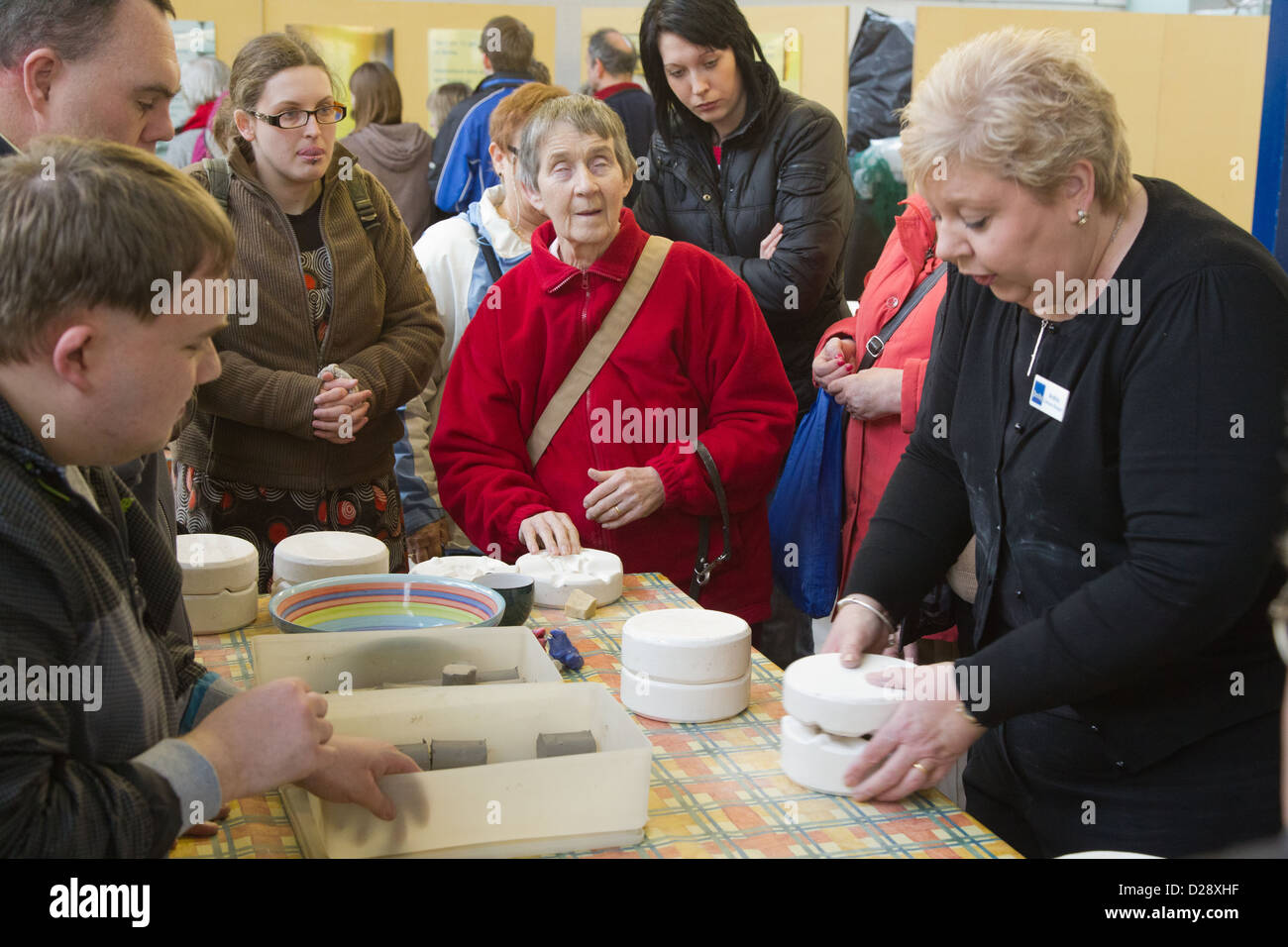 Visually impaired people with carers on outing to Denby Pottery ...