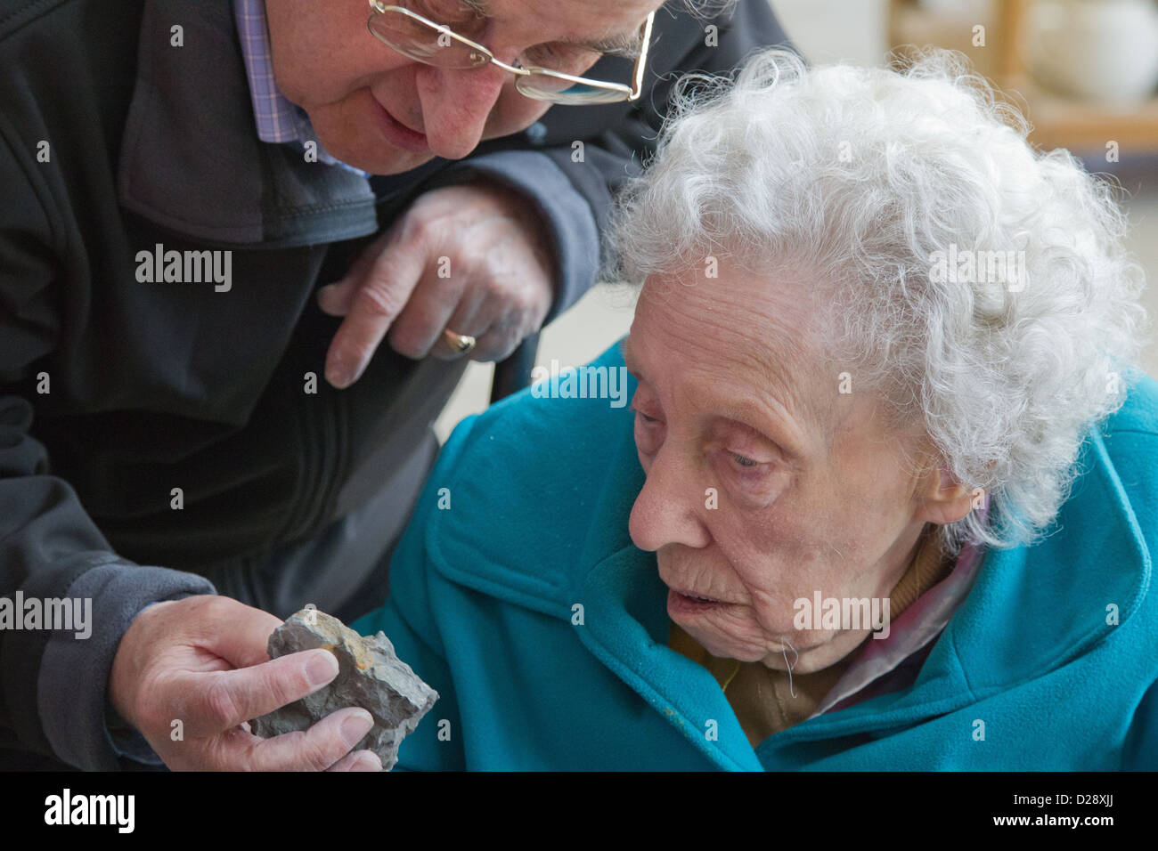 Visually impaired people with carers on outing to Denby Pottery. Helper ...