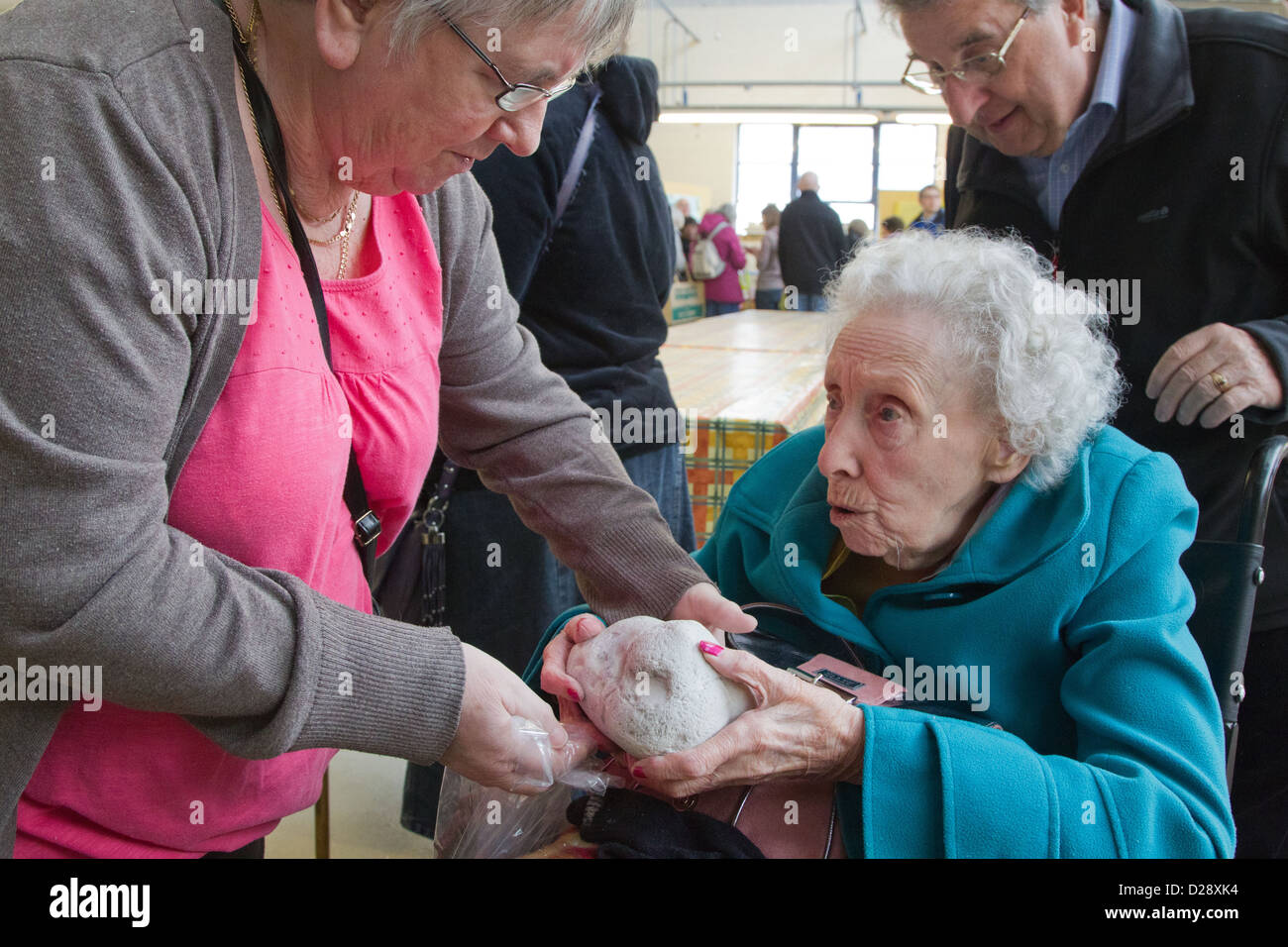 Visually impaired people with carers on outing to Denby Pottery ...
