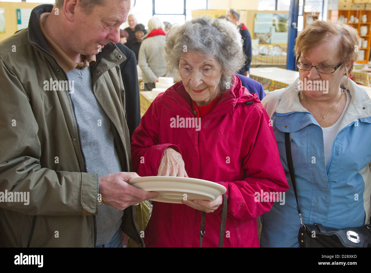 Visually impaired people with carers on outing to Denby Pottery ...