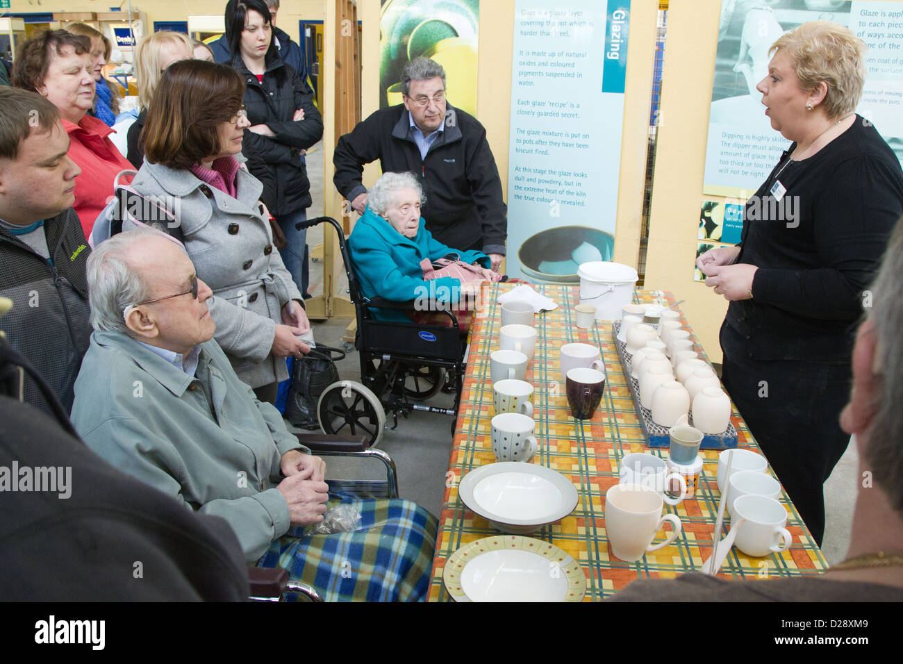 Visually impaired people with carers on outing to Denby Pottery ...