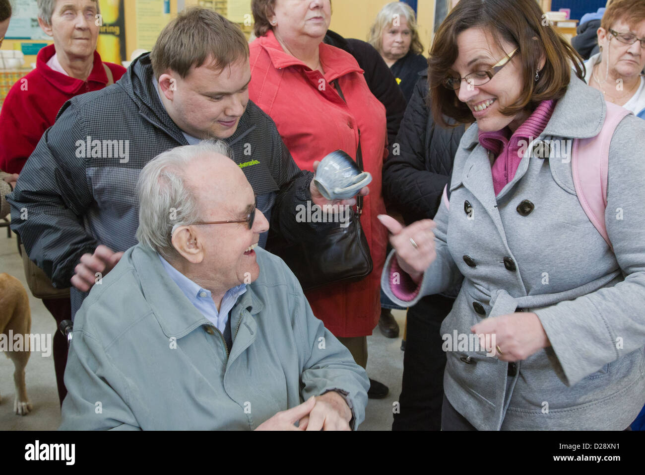 Visually impaired people with carers on outing to Denby Pottery ...