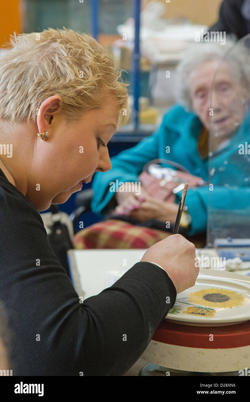 Visually impaired people with carers on outing to Denby Pottery ...