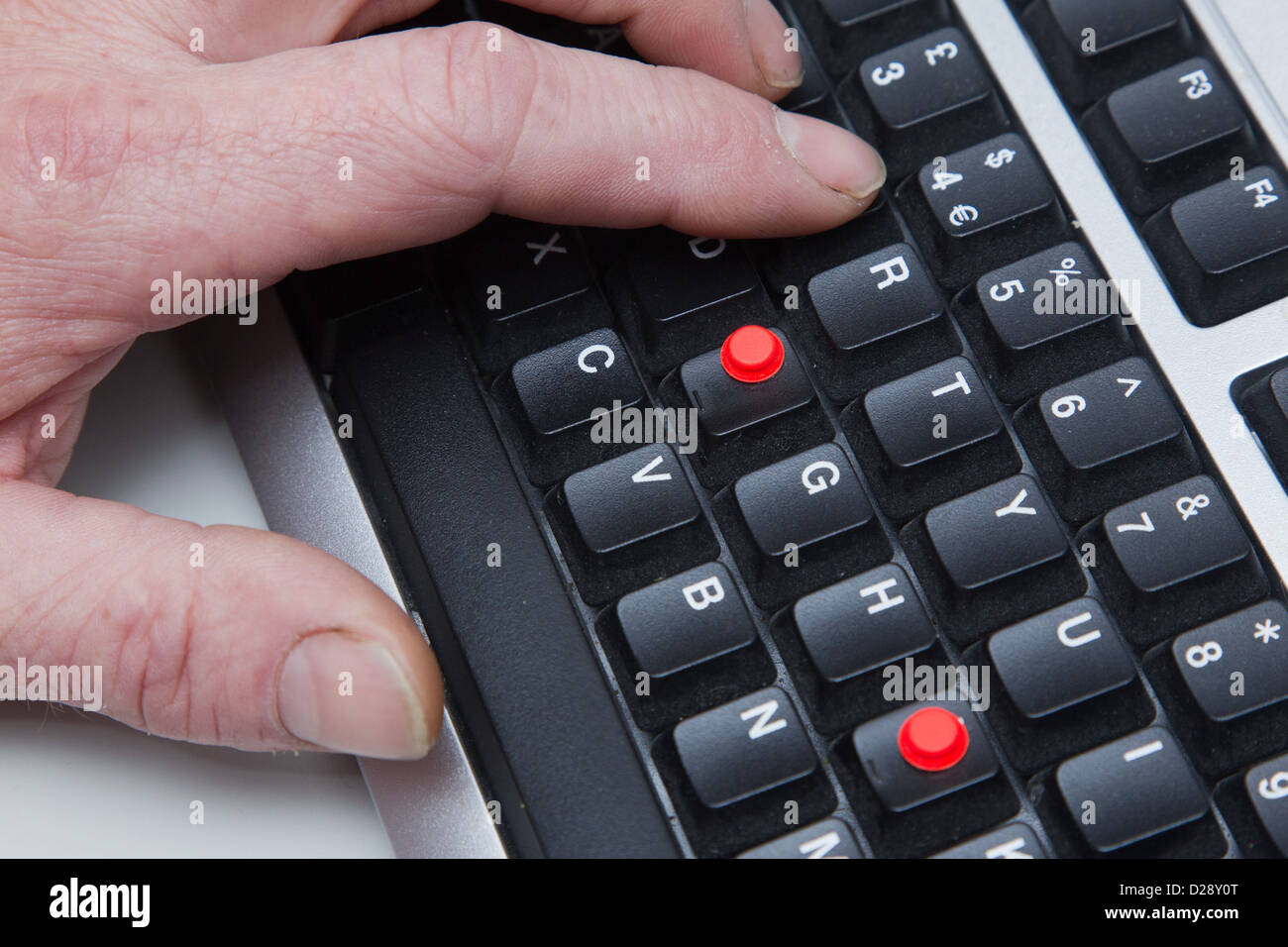 Computer class for people with visual impairments - man using keyboard ...