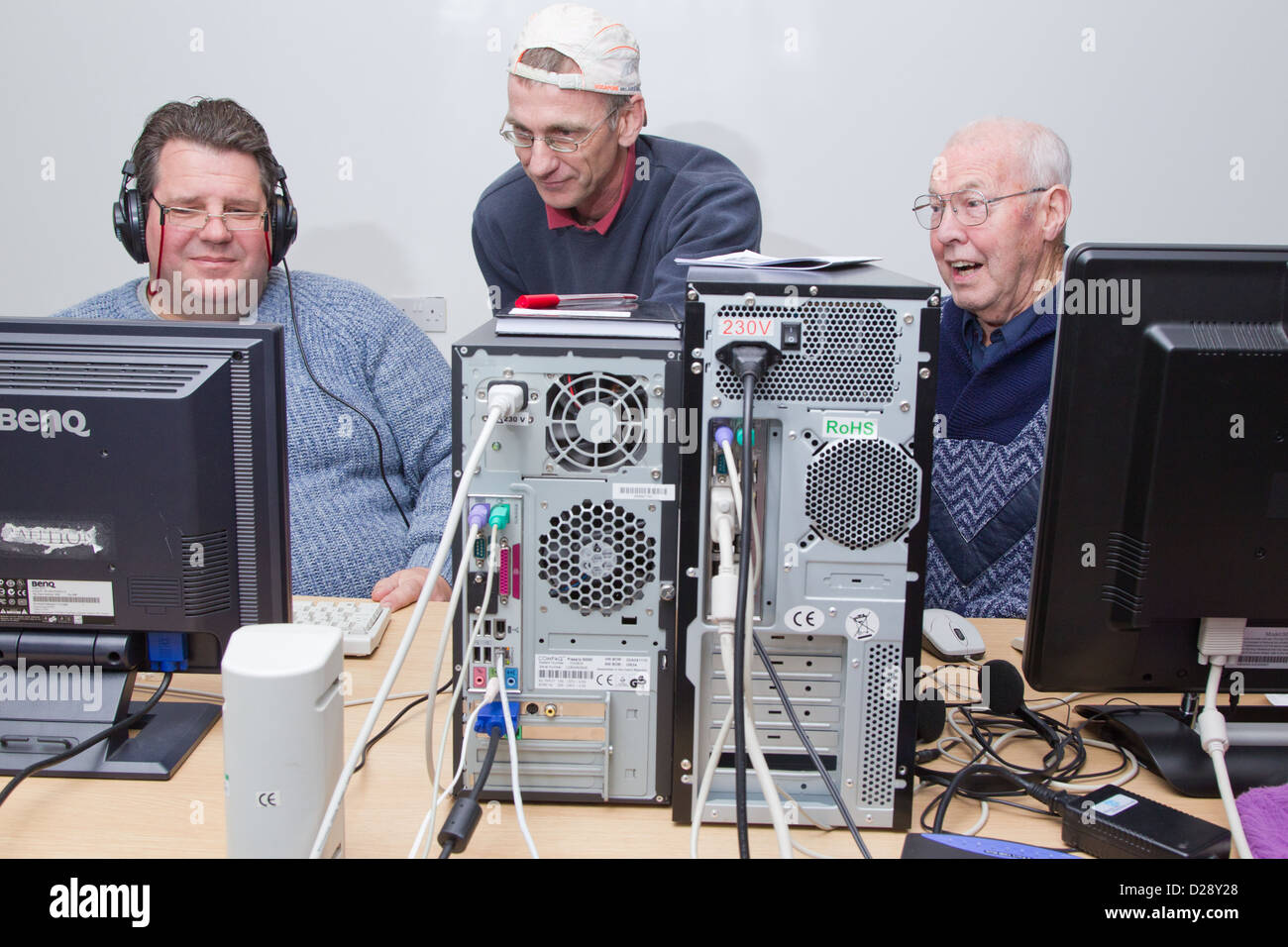 Computer class for people with visual impairments - group of men ...