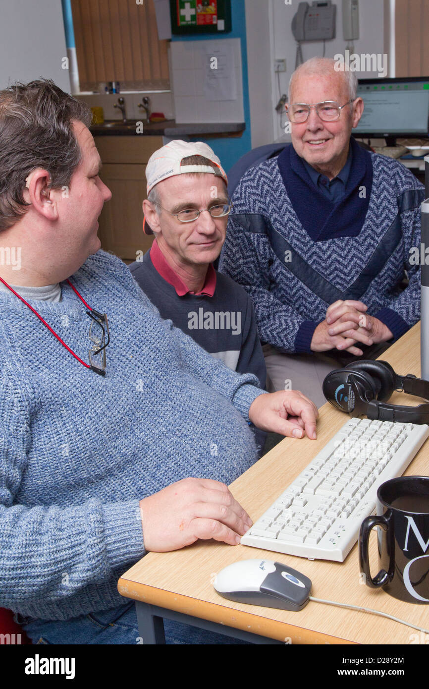 Computer class for people with visual impairments - group of men ...