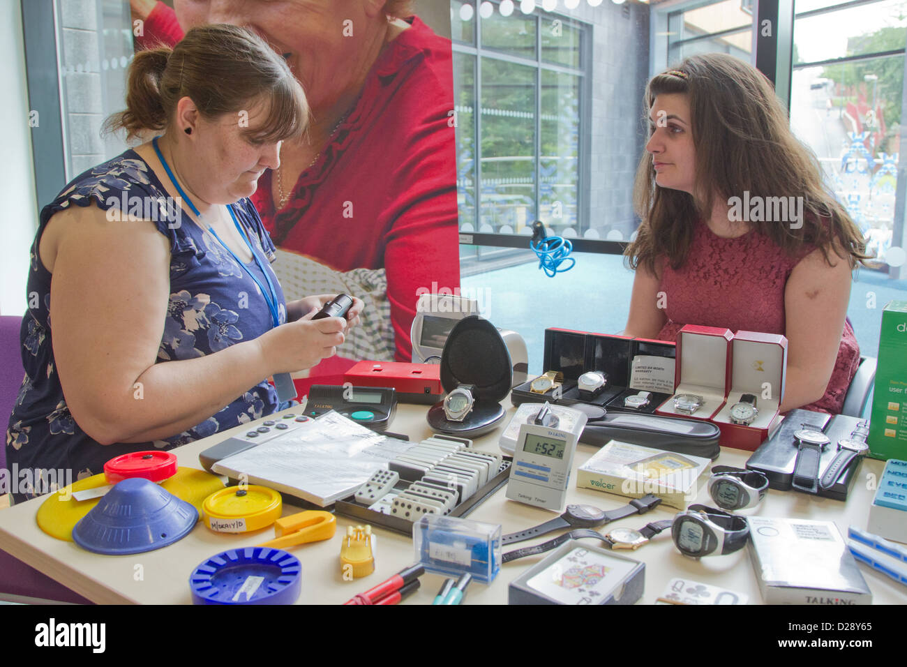 Out reach workers with stall of aids for visually impaired people Stock ...