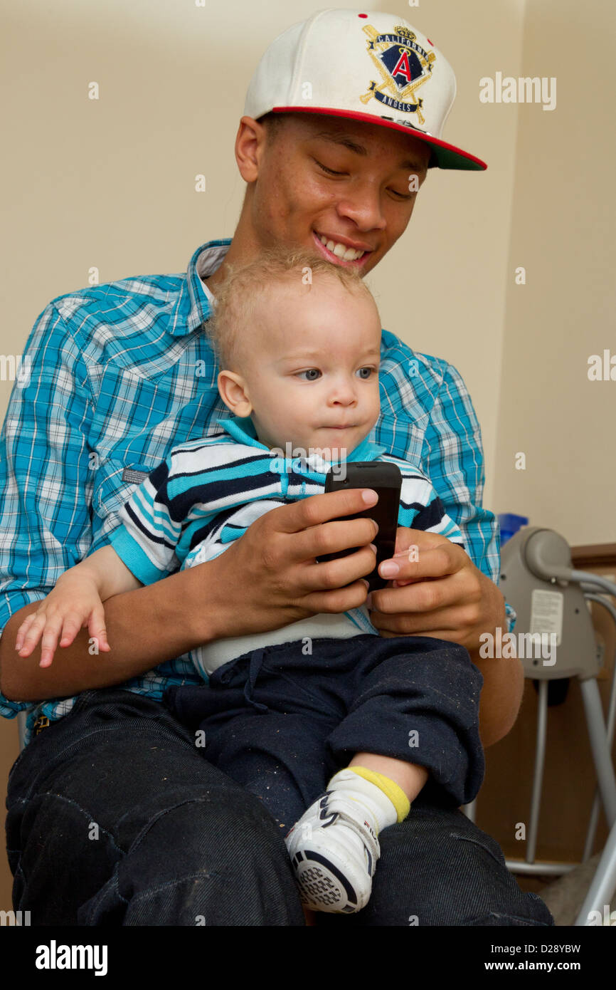 Teenage boy with younger brother Stock Photo - Alamy