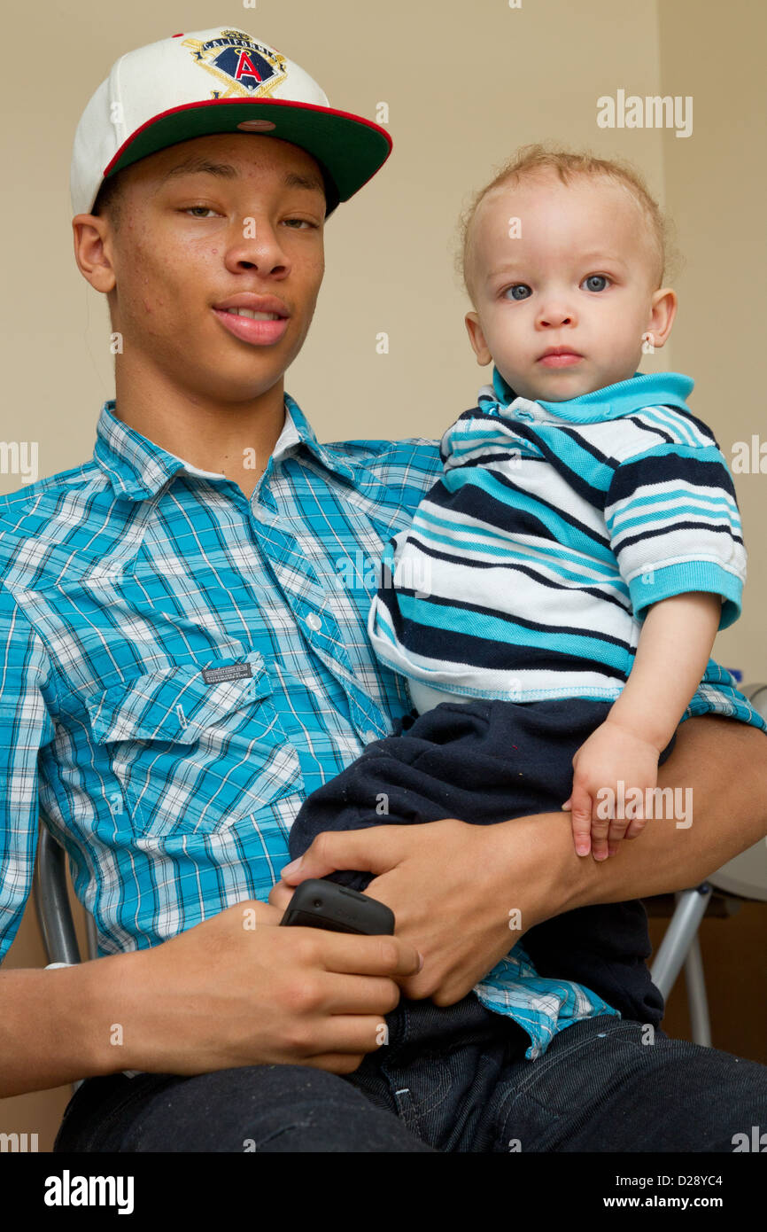 Small boy with older brother Stock Photo - Alamy
