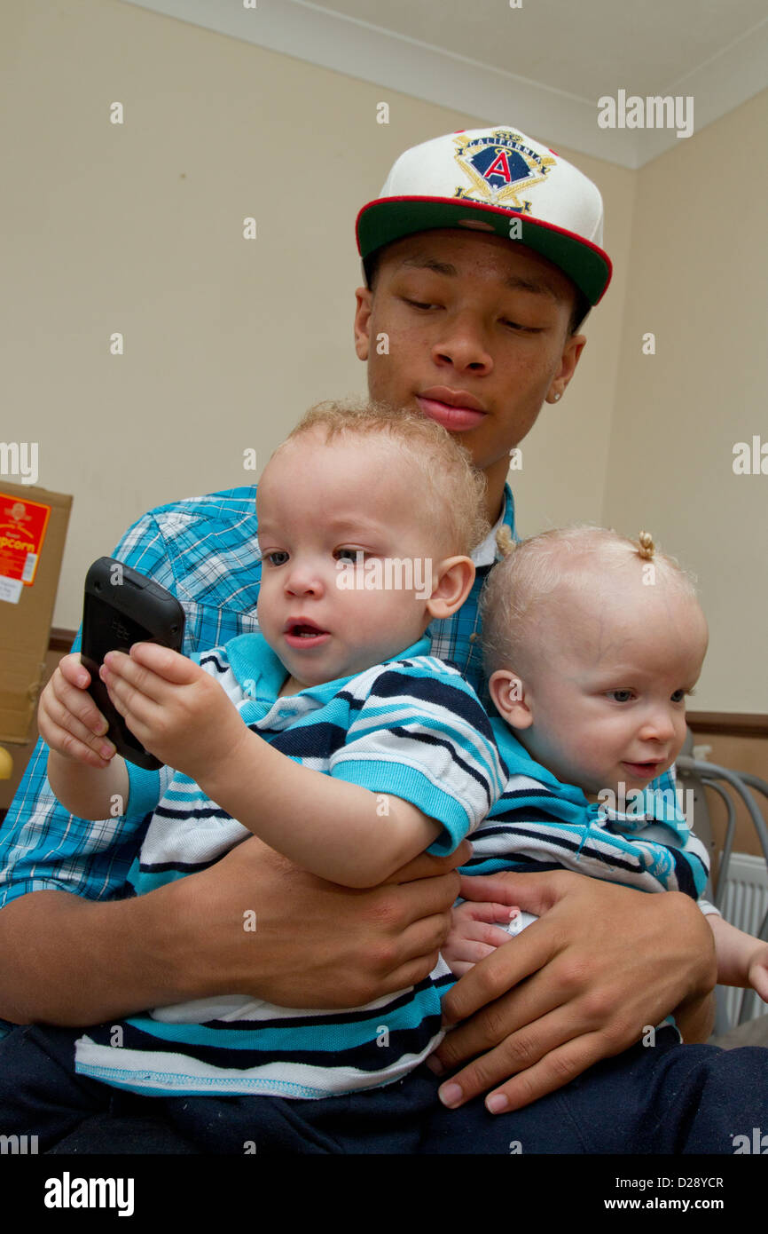 Twins babies with young dad hi-res stock photography and images - Alamy