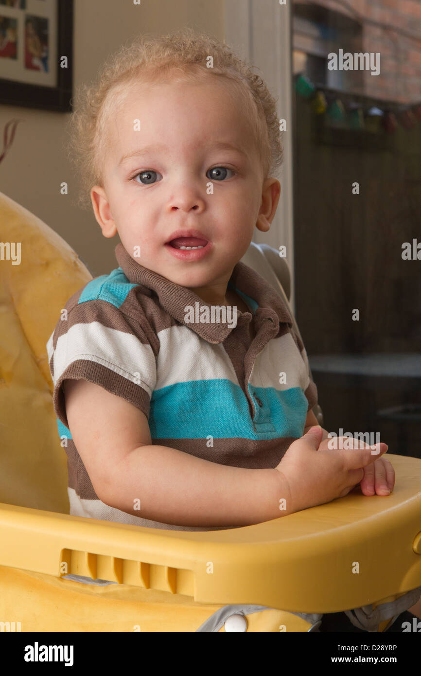 Toddler in high chair Stock Photo - Alamy