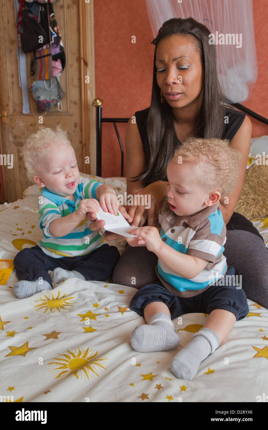 Mother with twins Stock Photo - Alamy