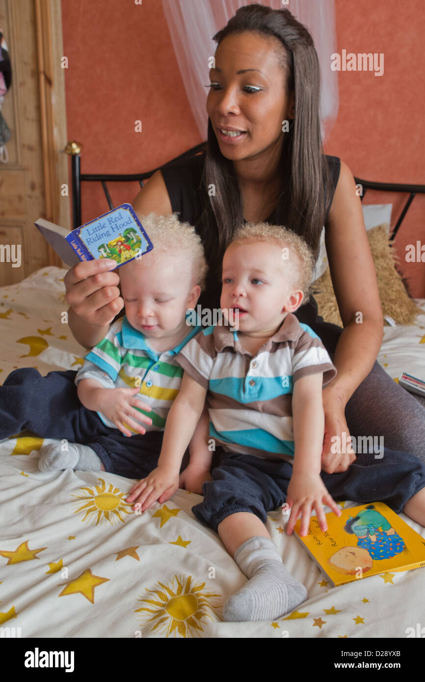 Mother with twins Stock Photo - Alamy