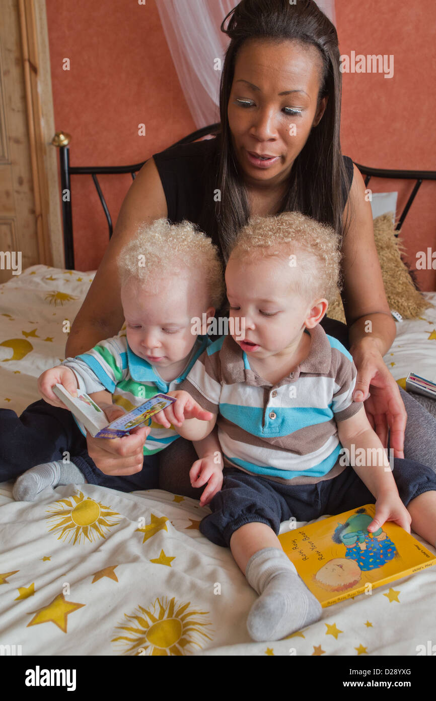 Mother with twins Stock Photo - Alamy