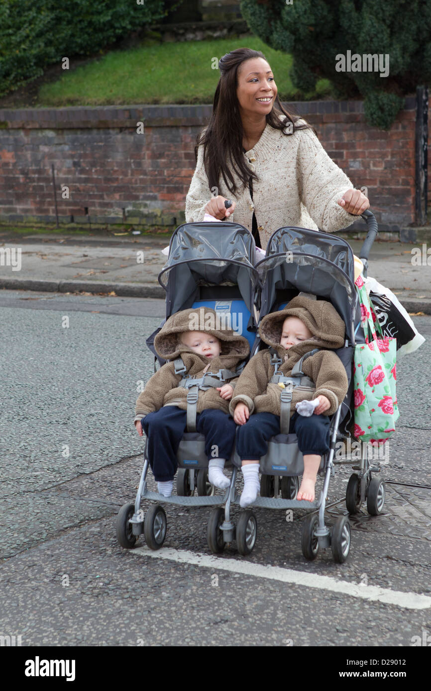 Mother with twins Stock Photo - Alamy