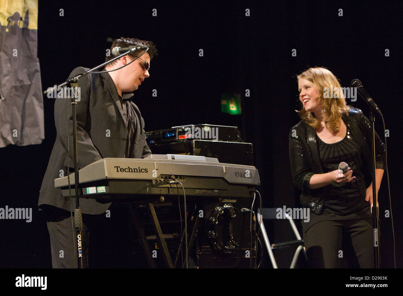 Musical duo featuring a visually impaired performer on keyboards and an ...