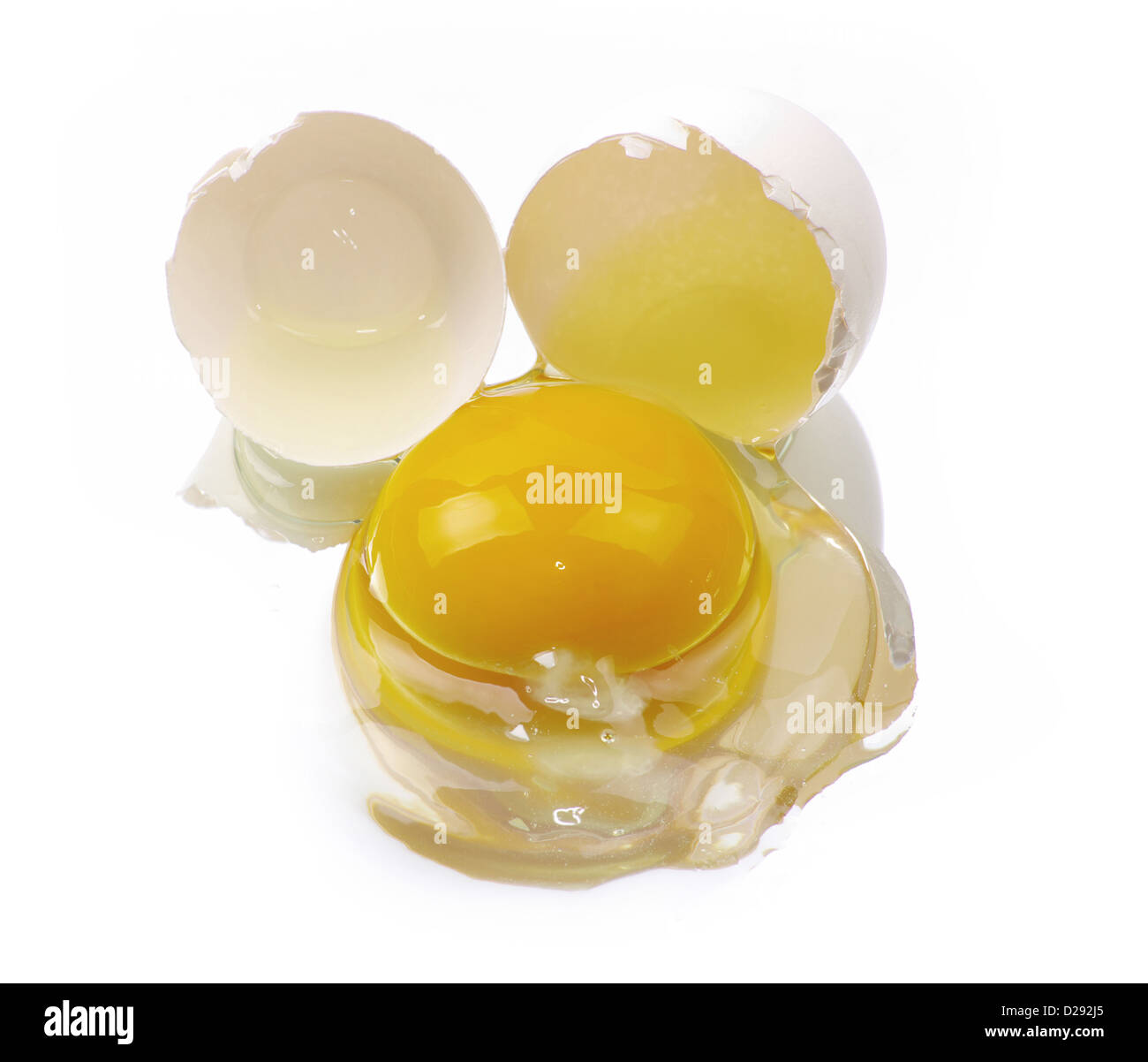 a broken egg on a white background isolated Stock Photo - Alamy