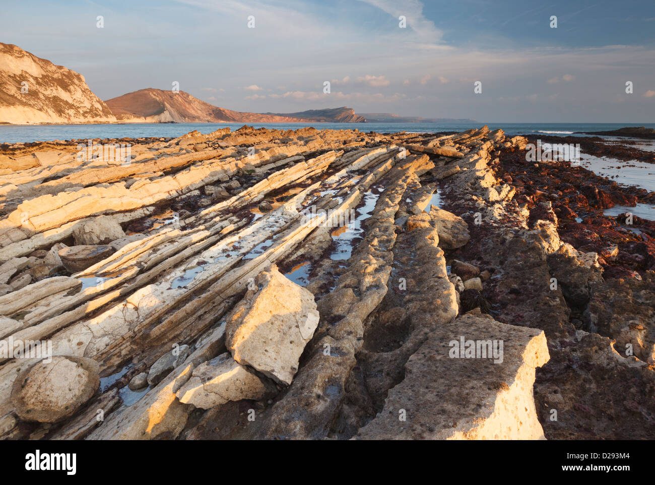 Beautiful late afternoon light across Mupe Bay in Dorset Stock Photo ...