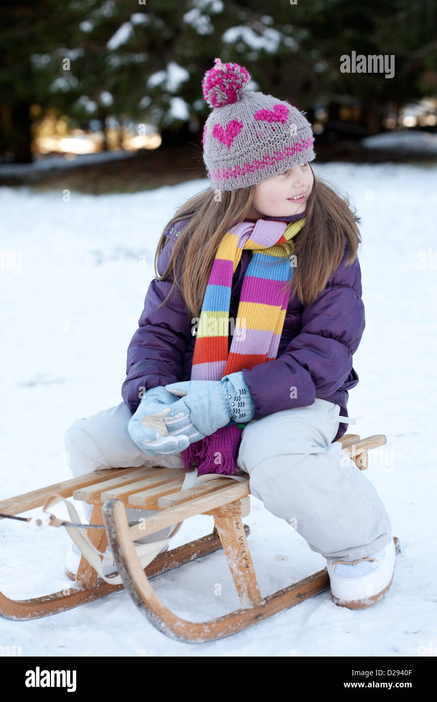 Girl with sleds Stock Photo - Alamy