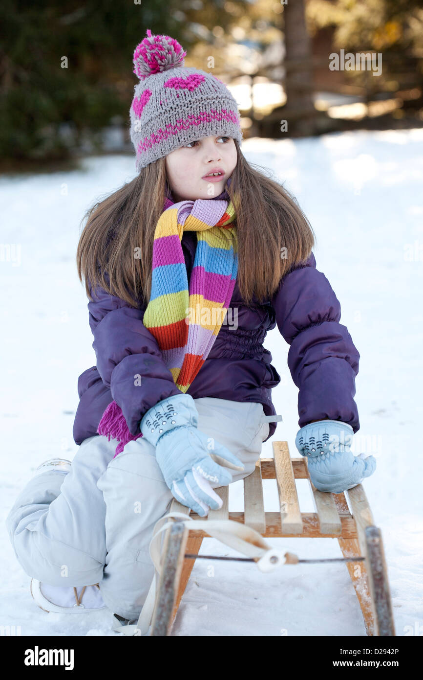 Girl with sleds Stock Photo - Alamy