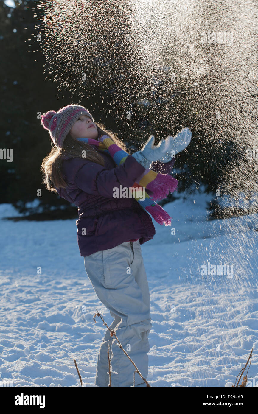 Girl having fun with snow Stock Photo - Alamy