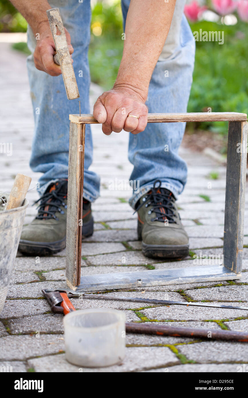 Building a brick pillar Stock Photo - Alamy