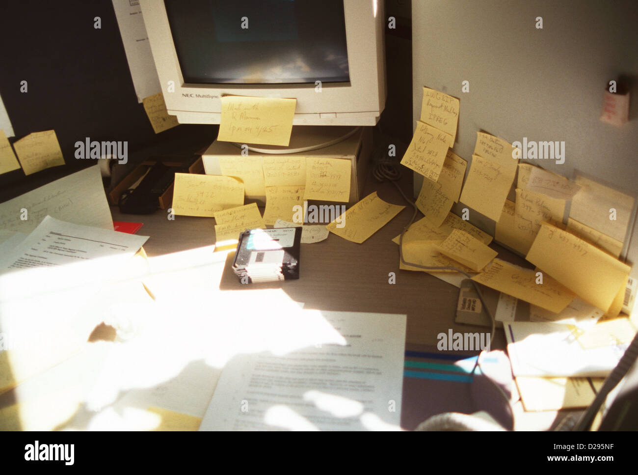 Computer and wall covered with post it notes hi-res stock photography ...