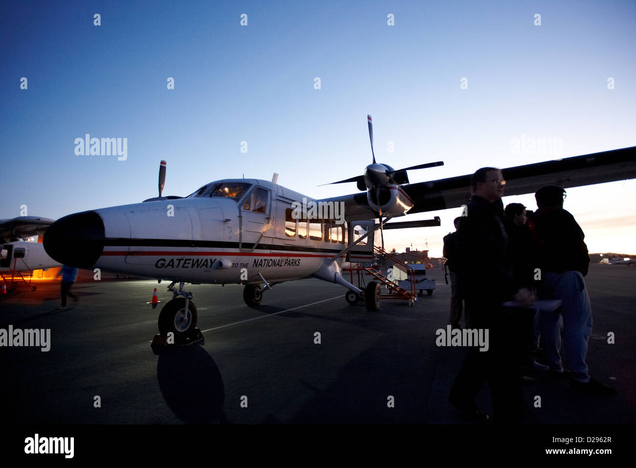 passengers boarding early morning dehaviland twin otter light aircraft ...