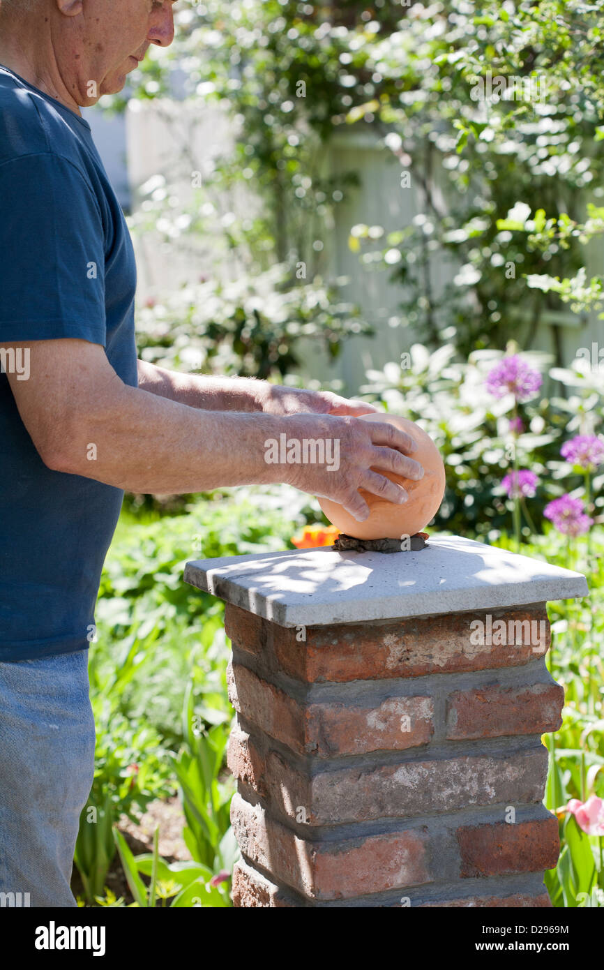 Building a brick pillar Stock Photo - Alamy