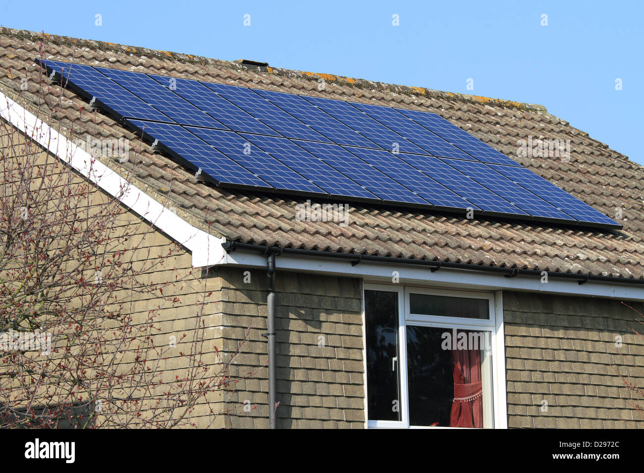 Solar photovoltaic panels on house roof Stock Photo - Alamy
