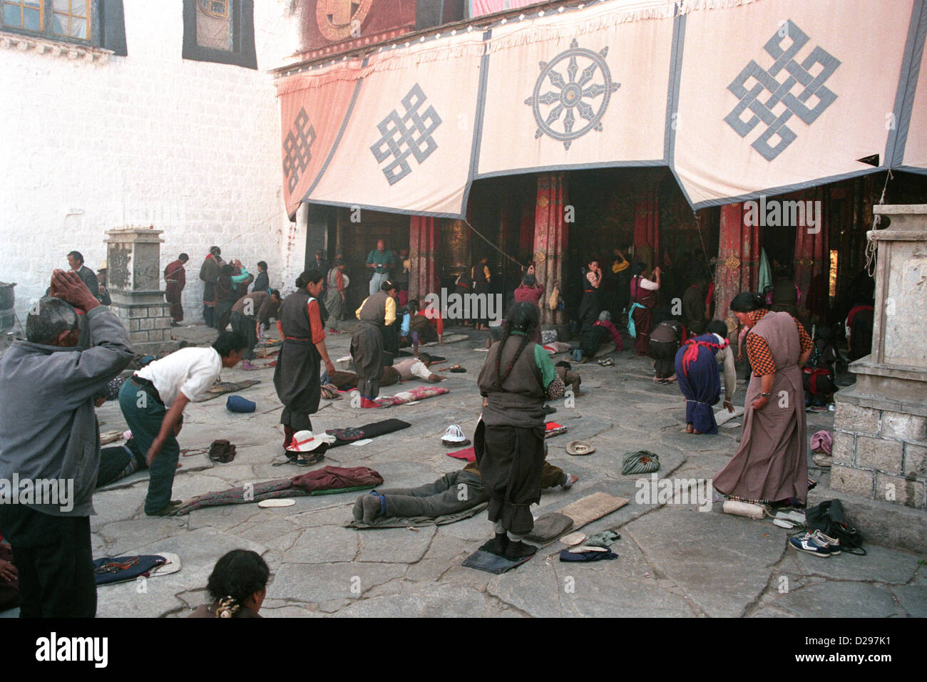 Tibet, Lhasa. People Praying Stock Photo - Alamy