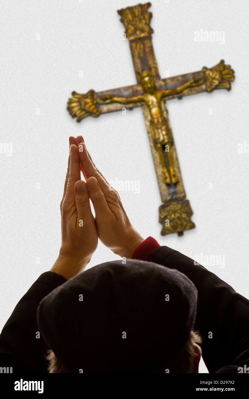 Man praying in front of crusifix Stock Photo - Alamy