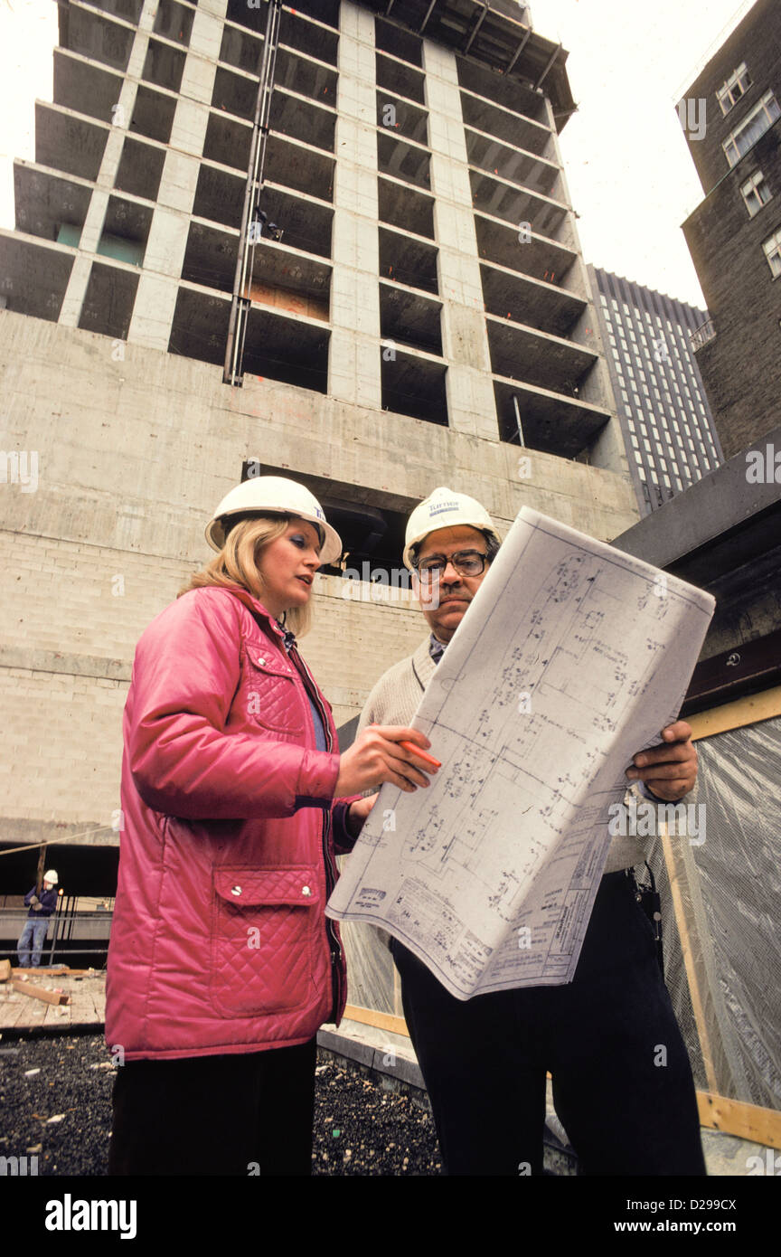 Architects looking blueprints people women occupations architects ...