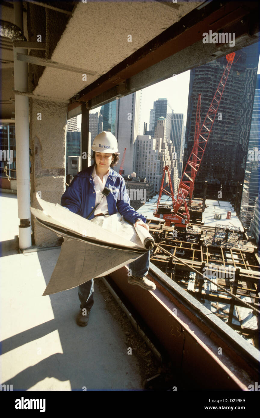 Female Construction Worker Reading Blueprints Stock Photo - Alamy