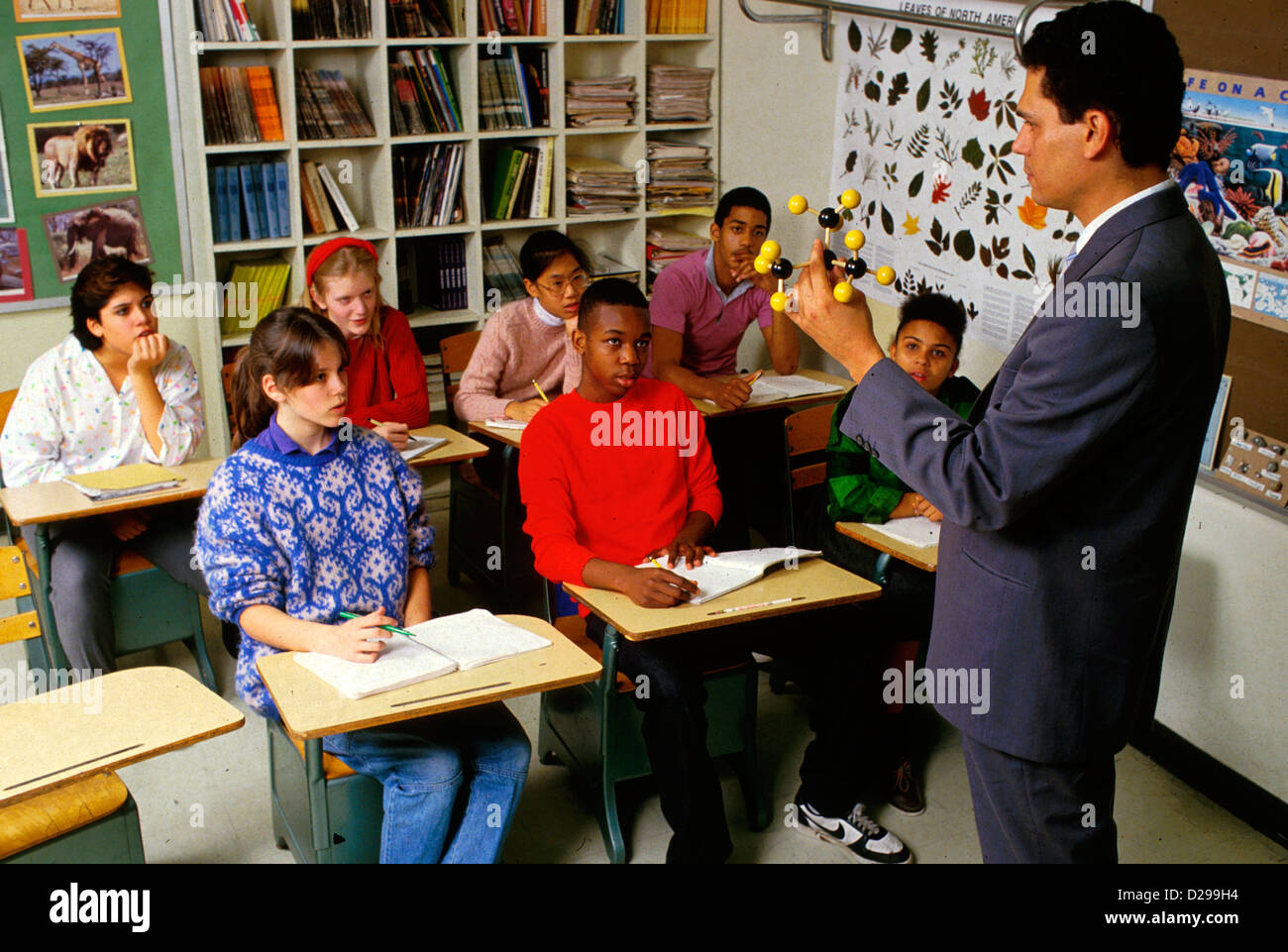 Teacher With Students In Science Class Stock Photo - Alamy