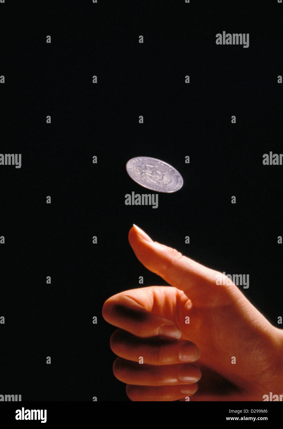 Coin flipping hi-res stock photography and images - Alamy