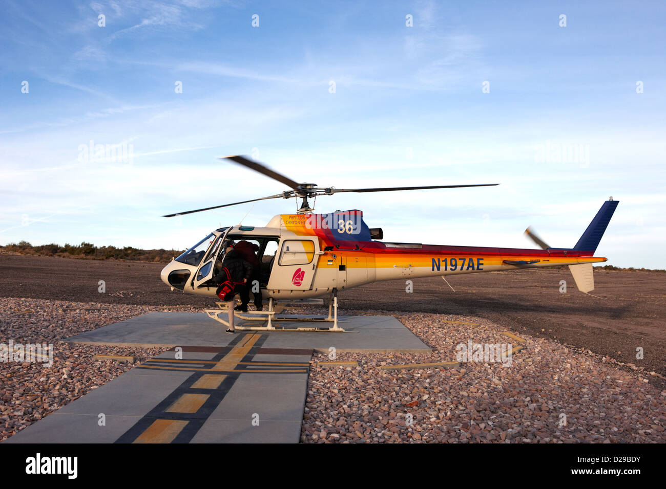 passengers boarding papillon helicopter tours on helipad at Grand ...