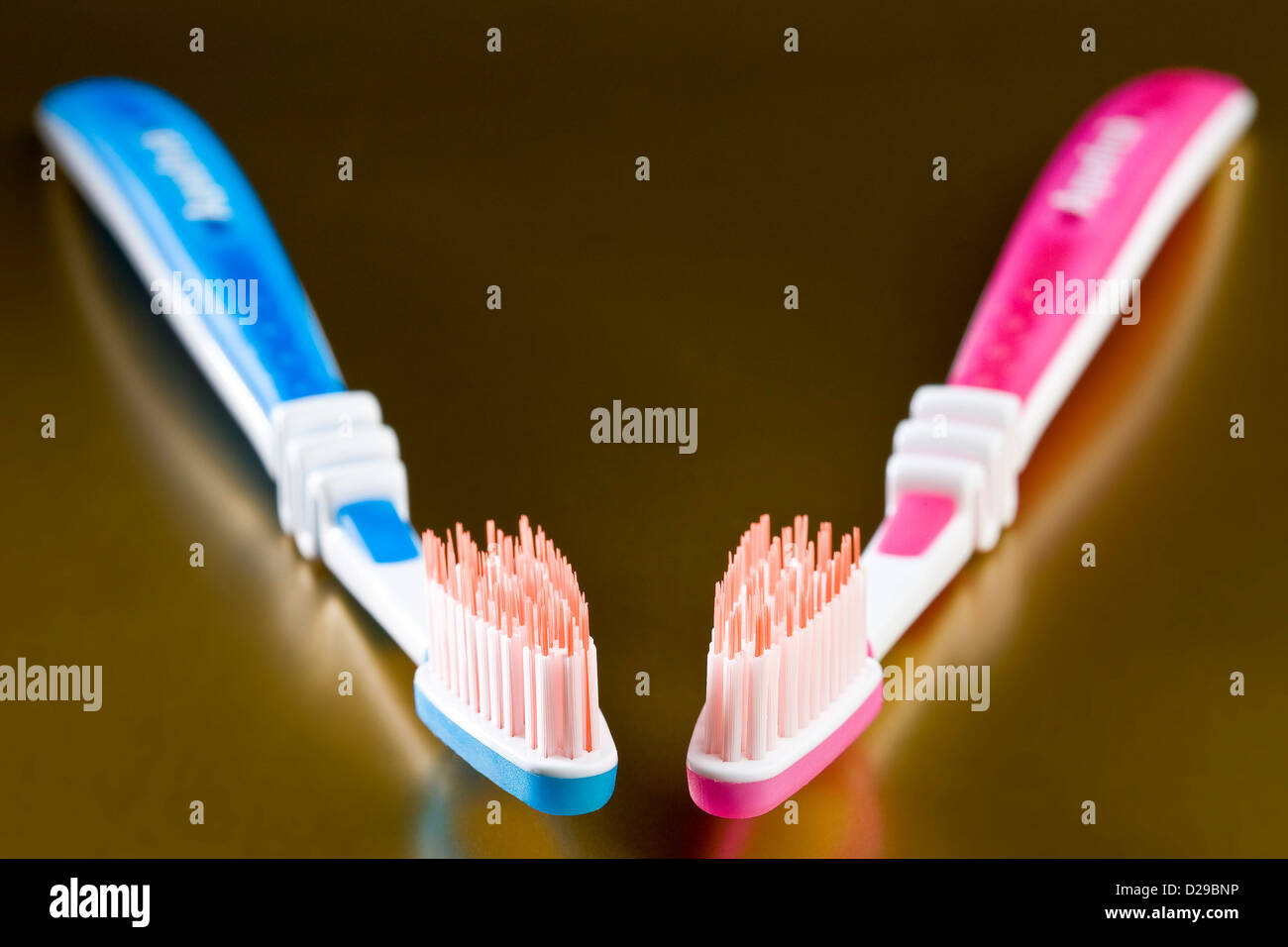 A blue and a red toothbrush Stock Photo - Alamy