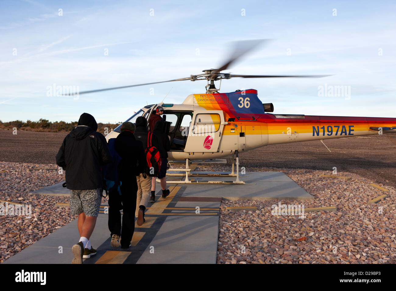passengers boarding papillon helicopter tours on helipad at Grand ...