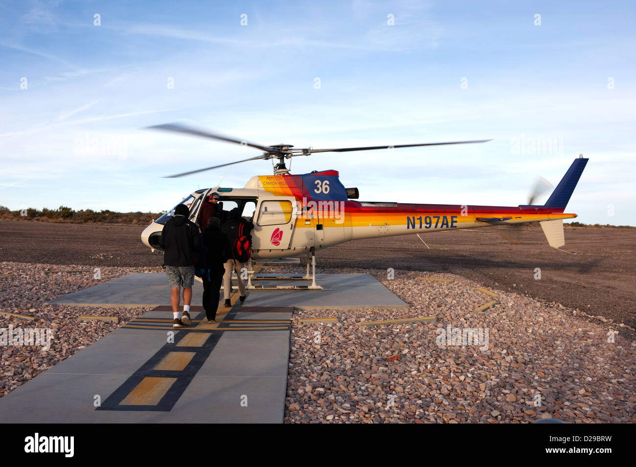 passengers boarding papillon helicopter tours on helipad at Grand ...