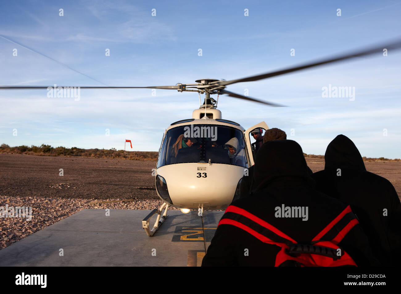 passengers boarding papillon helicopter tours on helipad at Grand ...