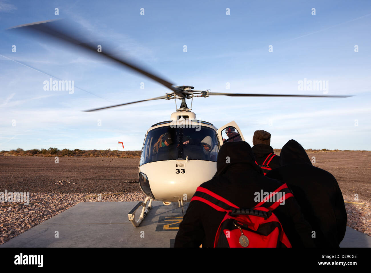 passengers boarding papillon helicopter tours on helipad at Grand ...
