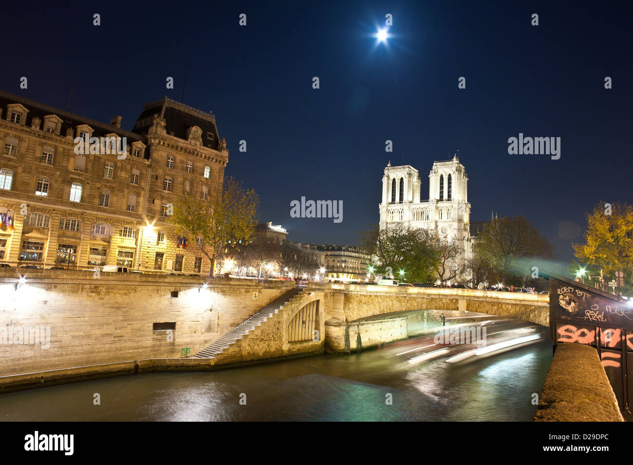 Paris in the latin quarter, view on Notre Dame cathedral at night ...