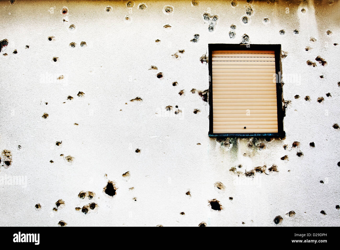 Bullet holes in a house facade Stock Photo - Alamy