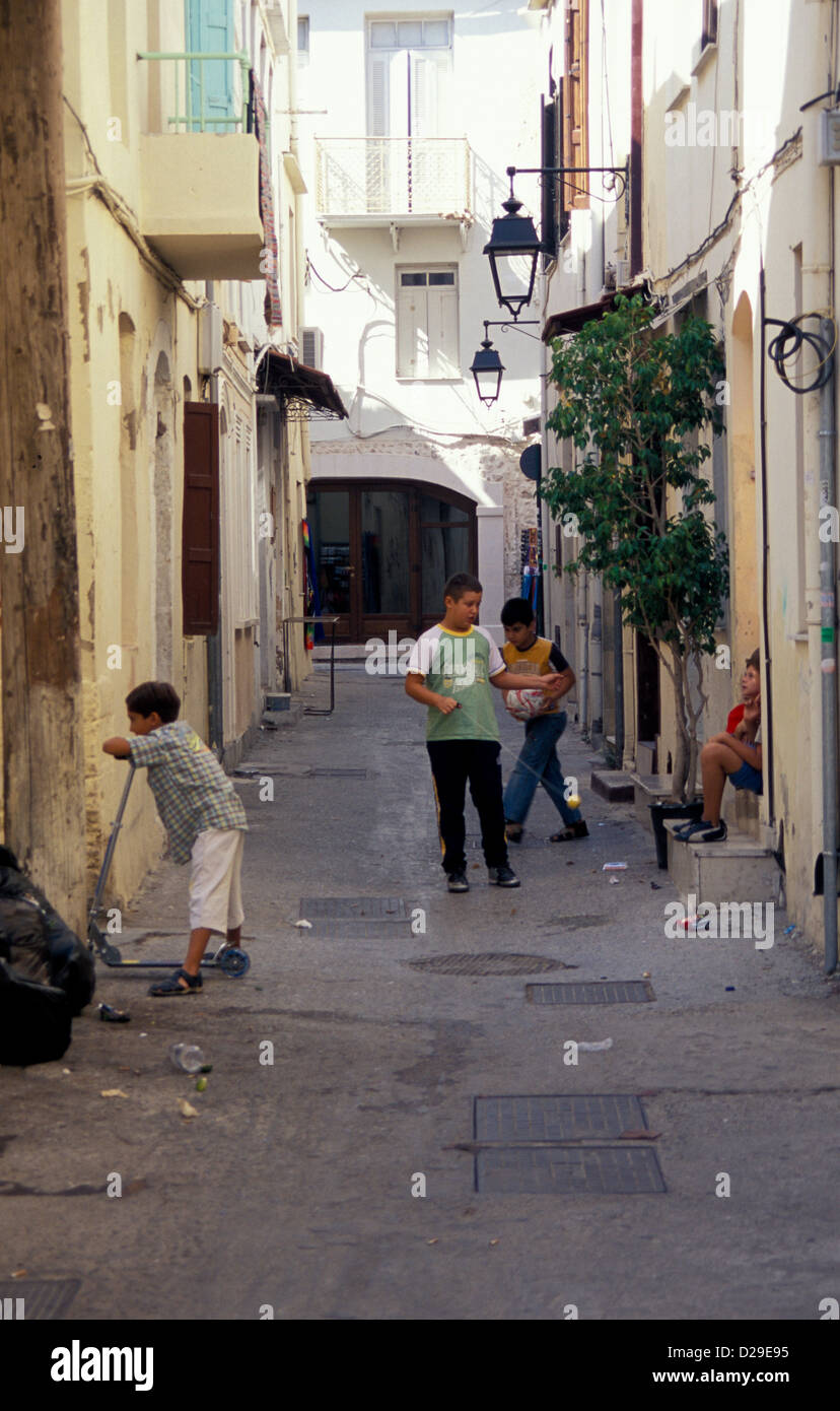 Greece. Crete. Rethymnon. Children Playing In Alley Stock Photo - Alamy