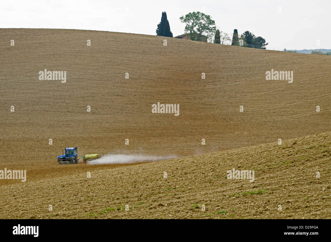 Applying Fertilizer On Tuscan Farm, Italy Stock Photo - Alamy