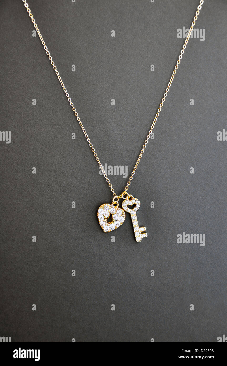 Chain and pendant - lock and key Stock Photo - Alamy