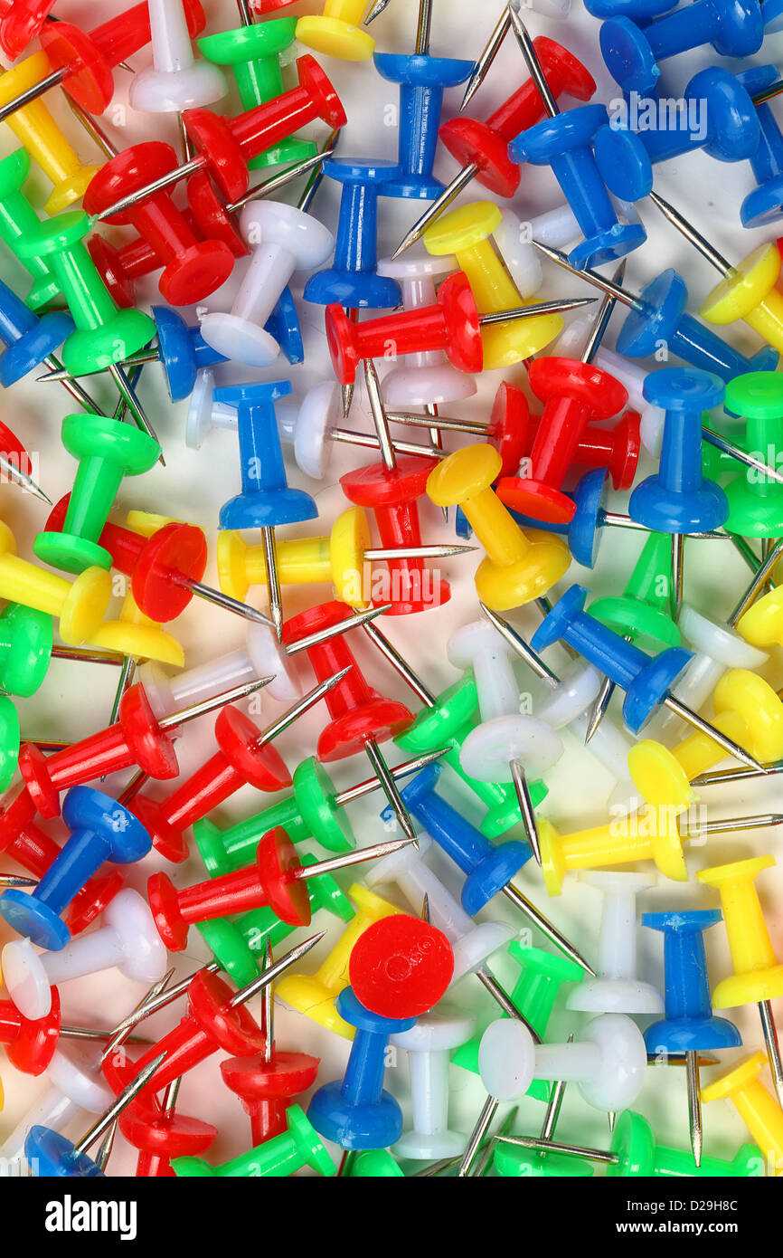 colorful pushpins on a white background Stock Photo - Alamy
